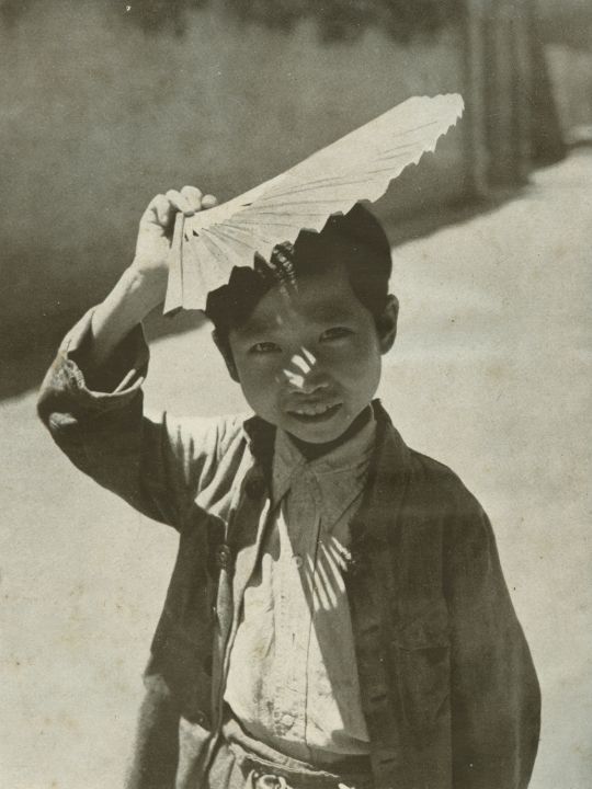 A boy with a paper fan - Edmund Archive - Photography, People & Figures ...