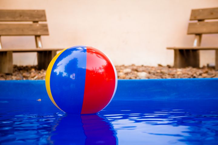 Colorful beach ball floating in pool - Maor Winetrob - Photography ...
